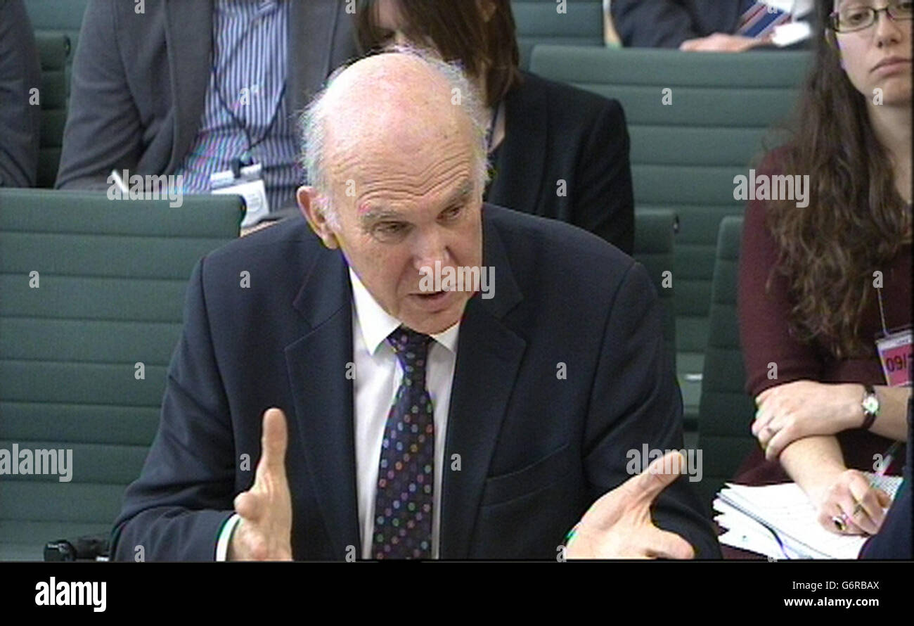 Business Secretary Vince Cable answers questions in front of the ...