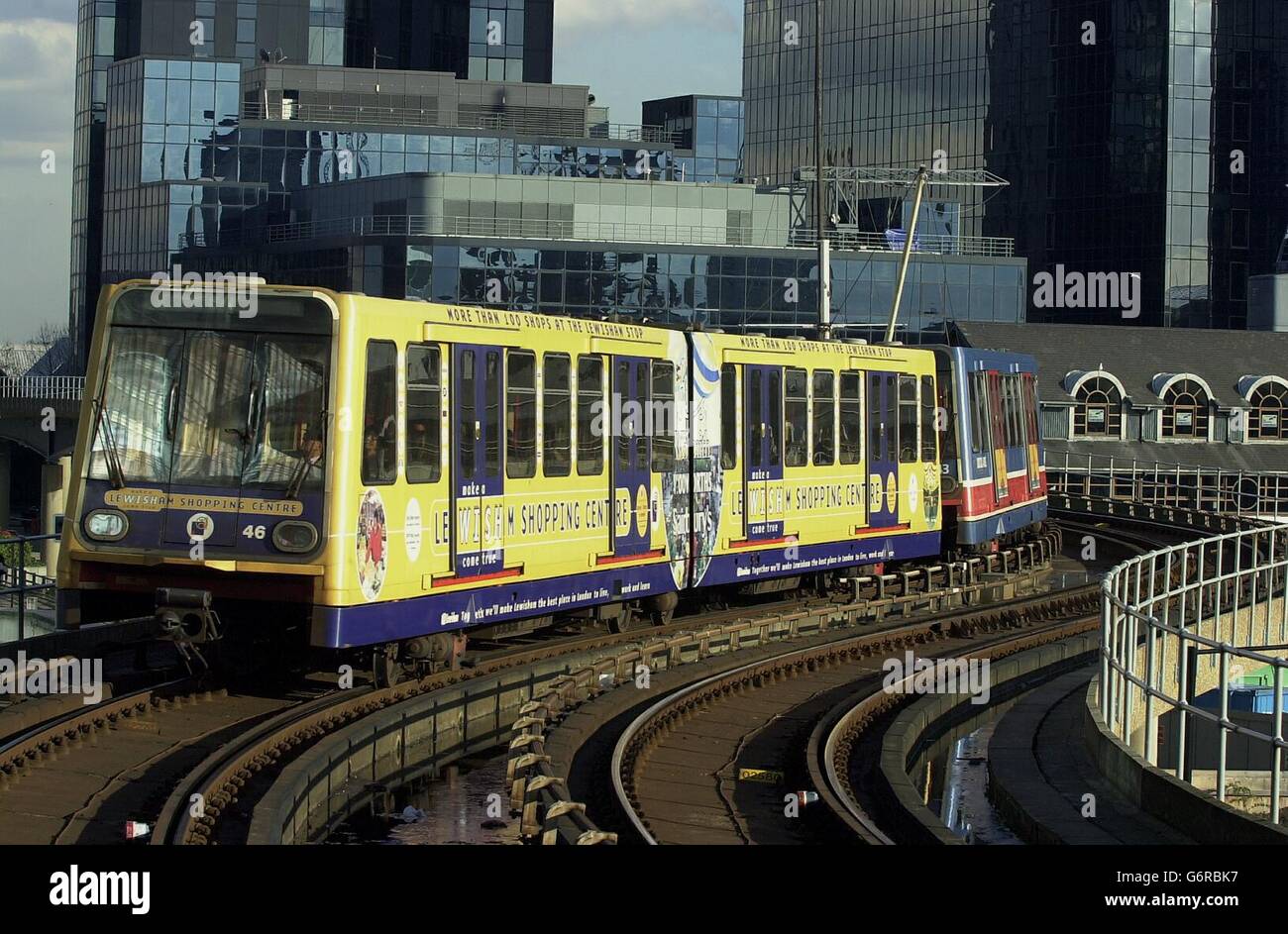 A train runs on the Docklands Light Railway Line in London, as plans ...