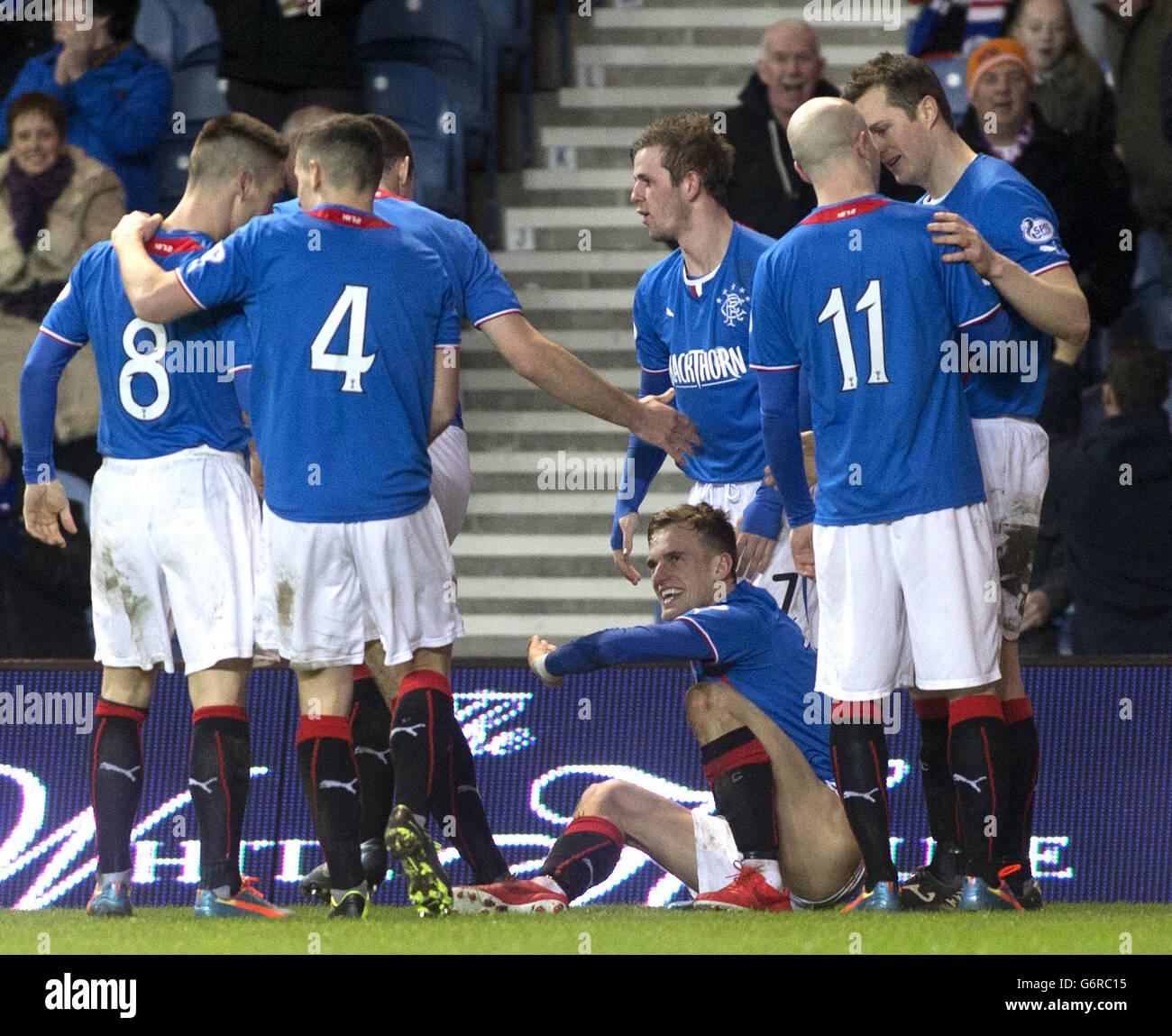 Rangers' Dean Shiels (ground) celebrates third goal with his team mates ...