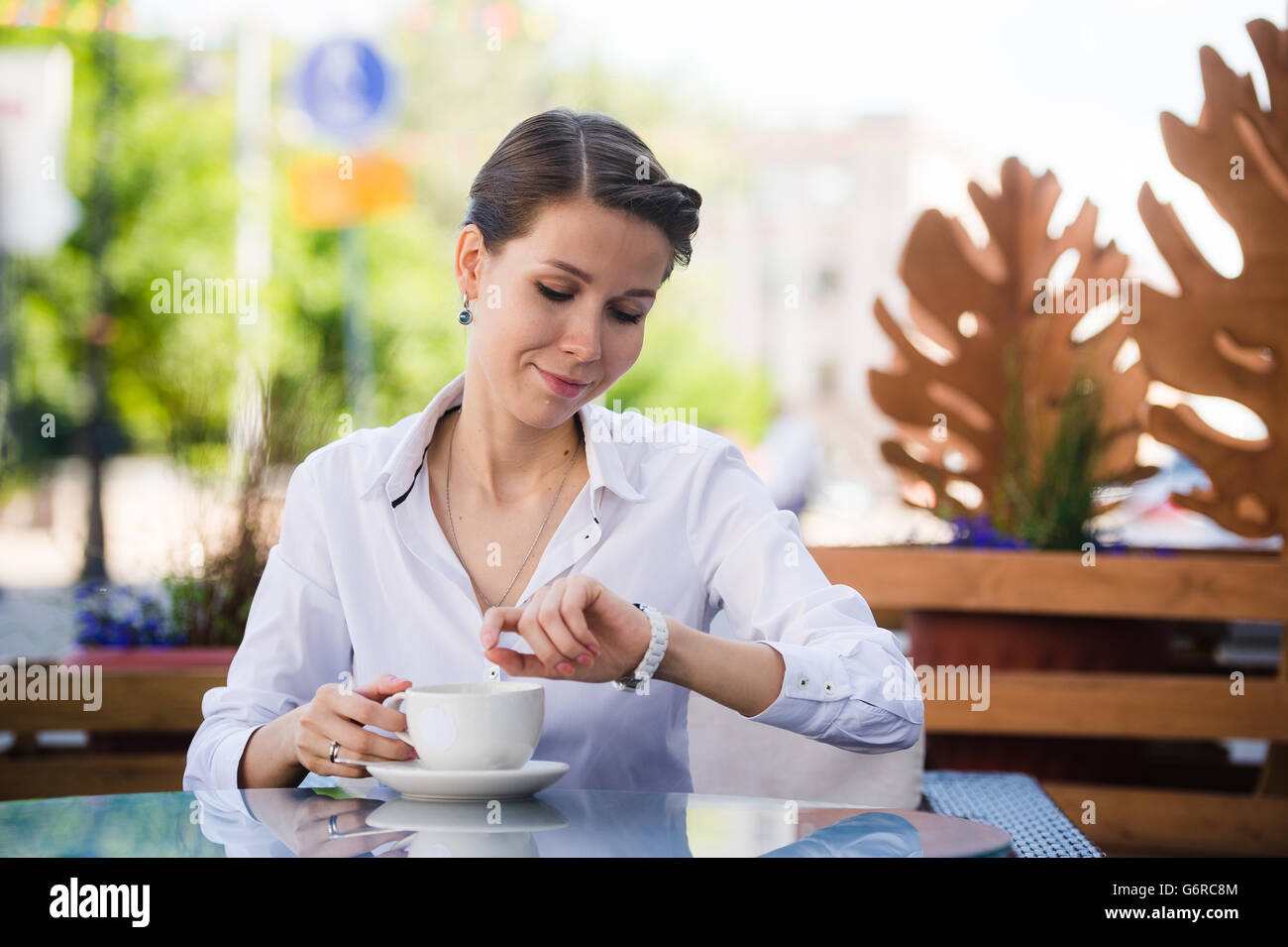 Woman watch blonde waiting hi-res stock photography and images - Alamy