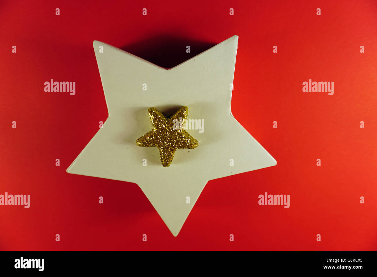 star gift box isolated on red background Stock Photo - Alamy