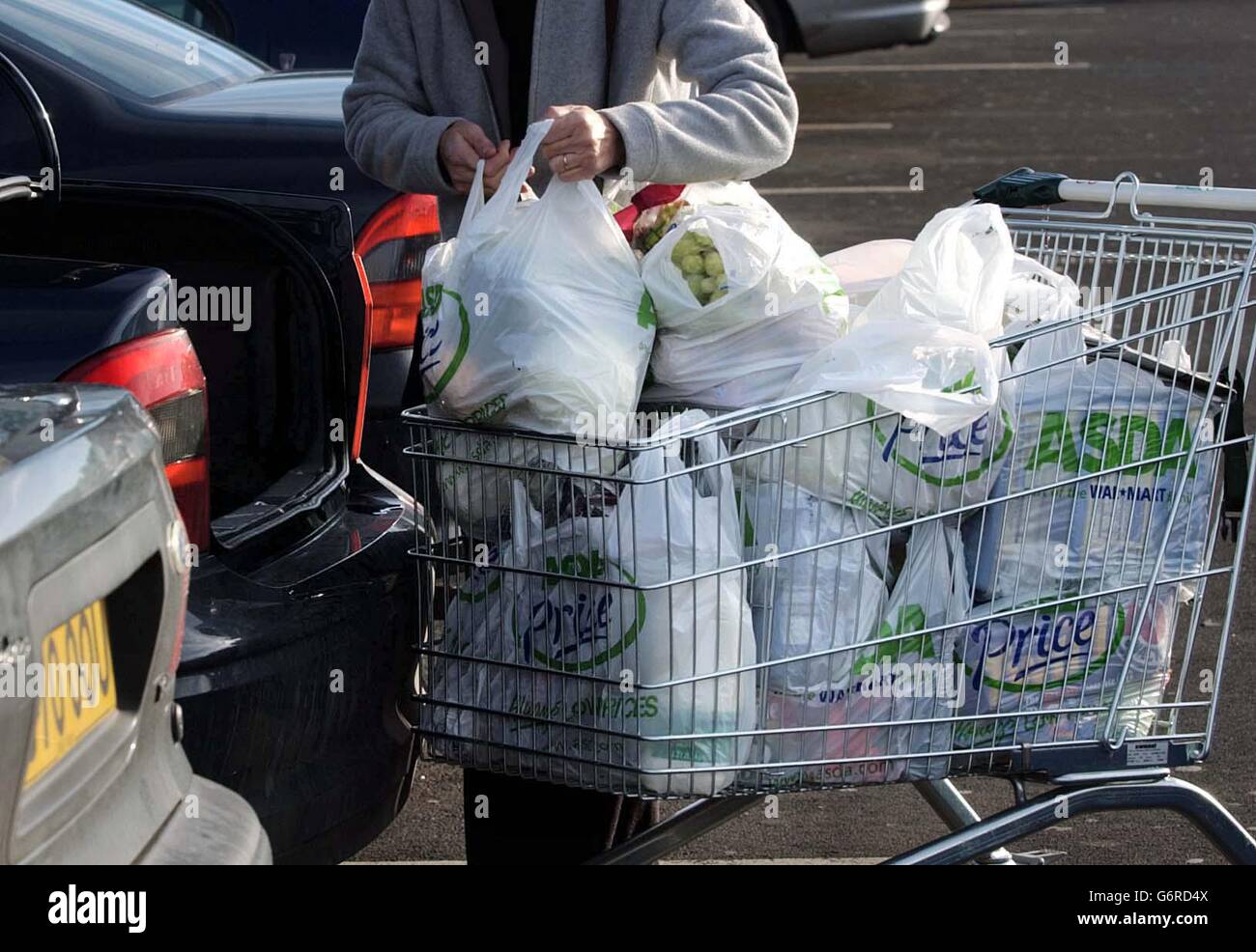 A general view of someone packing their shopping into the car at the ...