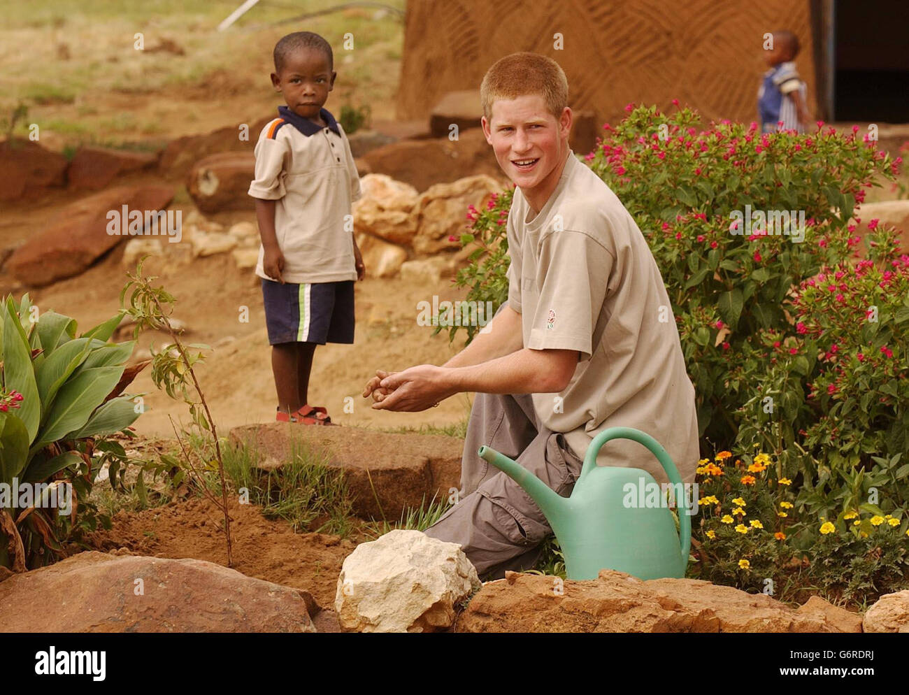 Prince Harry, the younger son of Britain's Prince Charles, with young ...