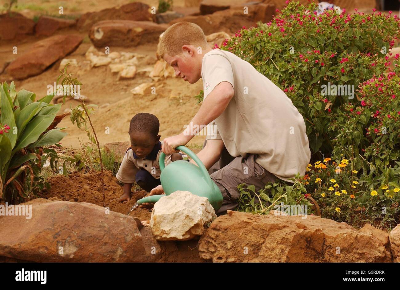 Prince Harry, the younger son of Britain's Prince Charles, with young ...