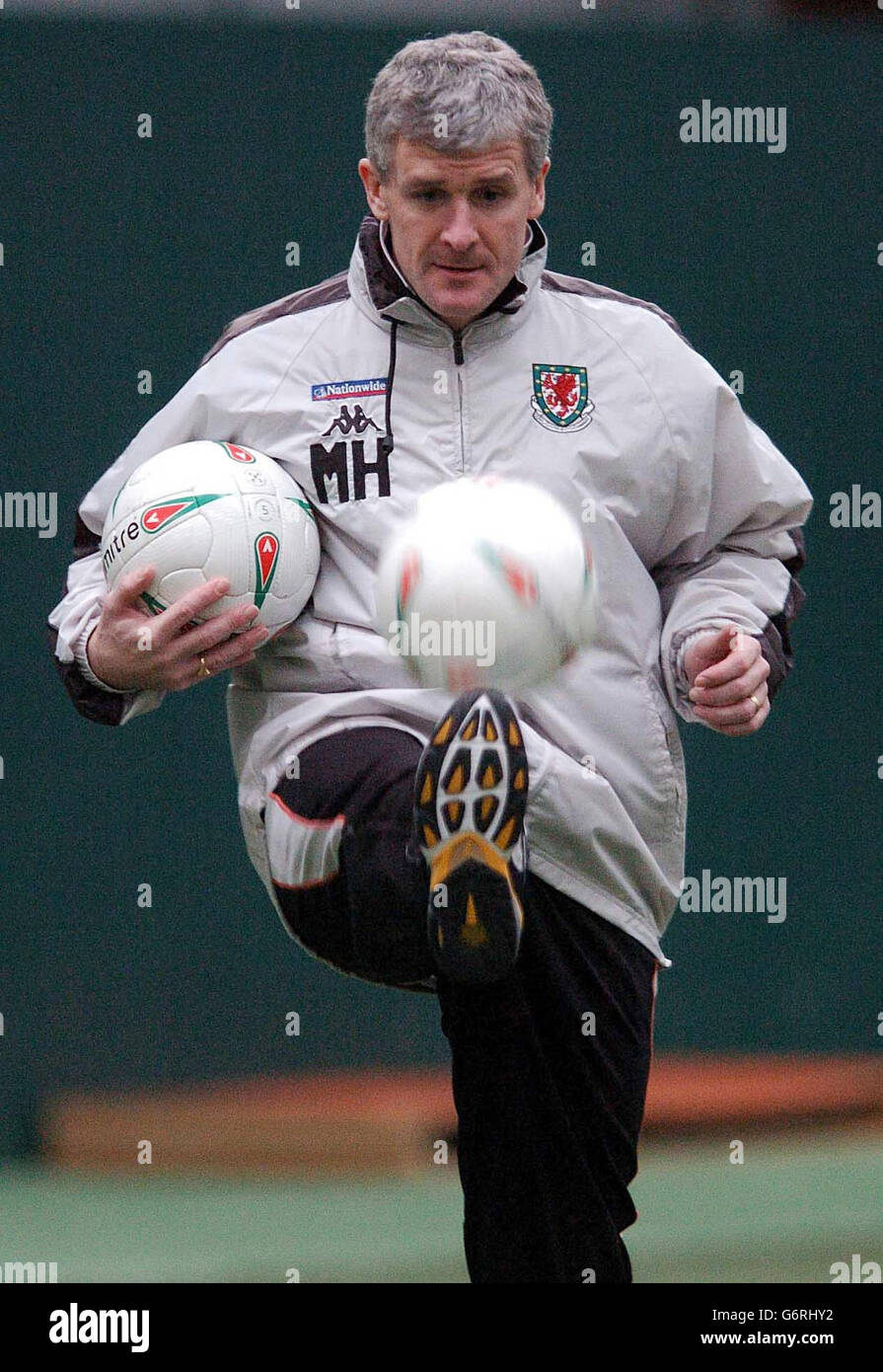 Wales football manager Mark Hughes shows some ball skills during ...