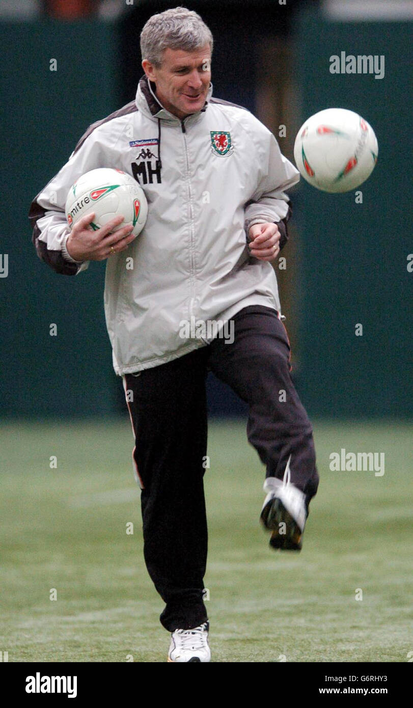 Wales football manager Mark Hughes shows some ball skills during ...