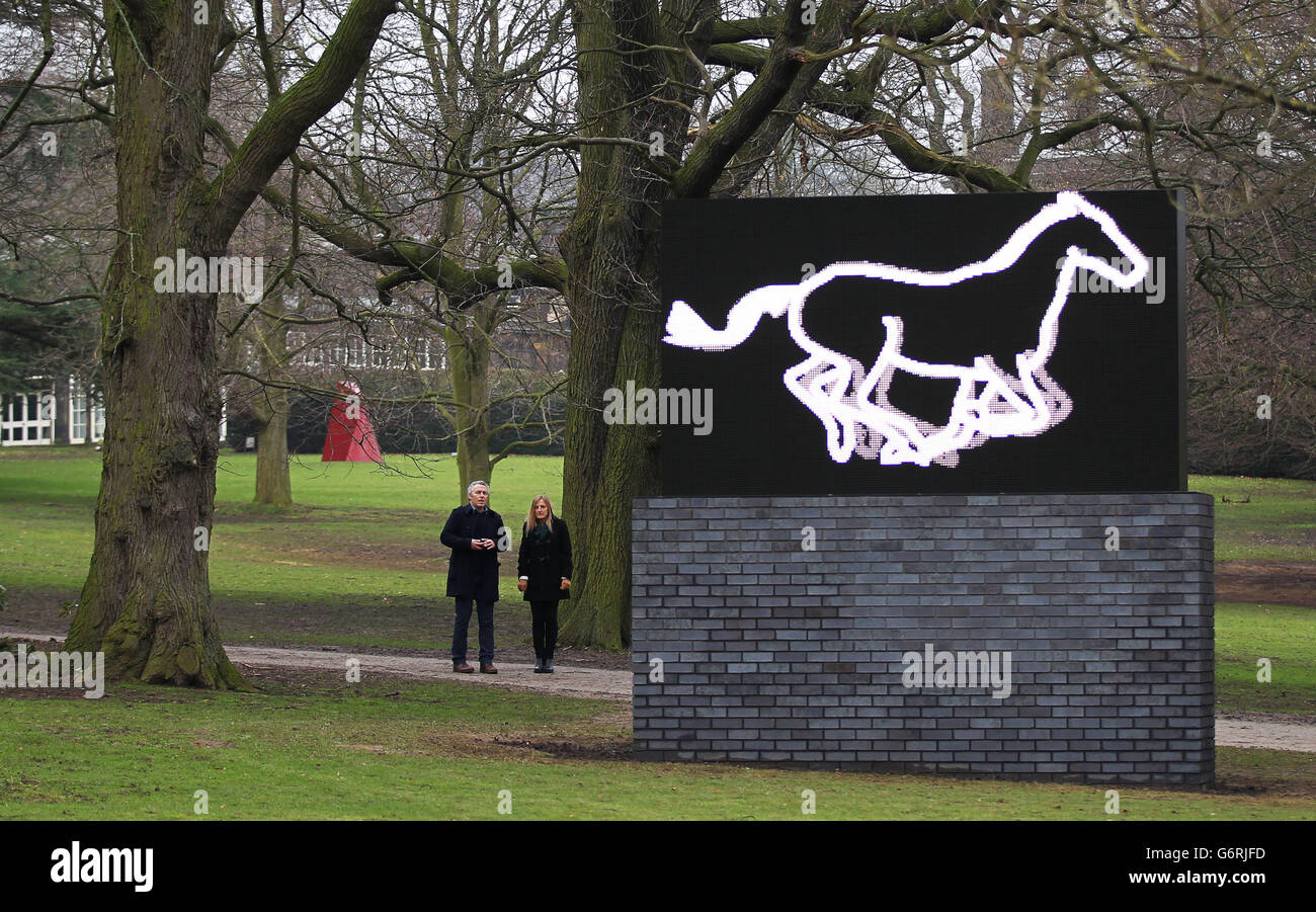Artist Julian Opie and his wife Aniela look at his LED sculpture ...