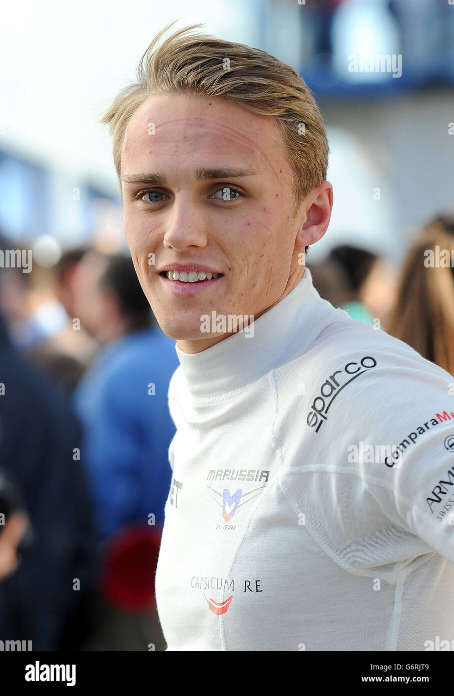 Marussia driver max chilton poses picture walks through paddock hi-res ...