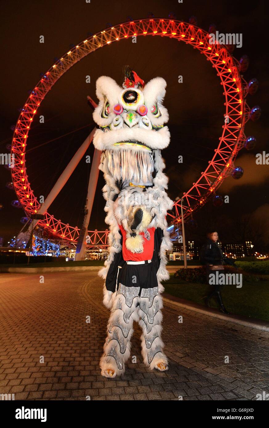 A traditional Chinese Tiger dances in front of the London Eye as it is ...