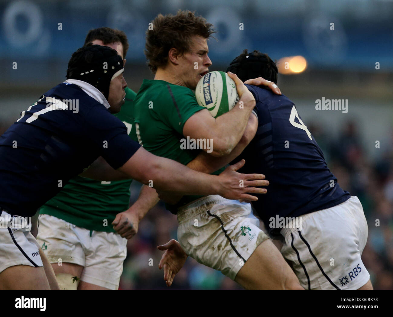 Ireland's Andrew Trimble (centre) and Scotland's Sean Maitland (left ...