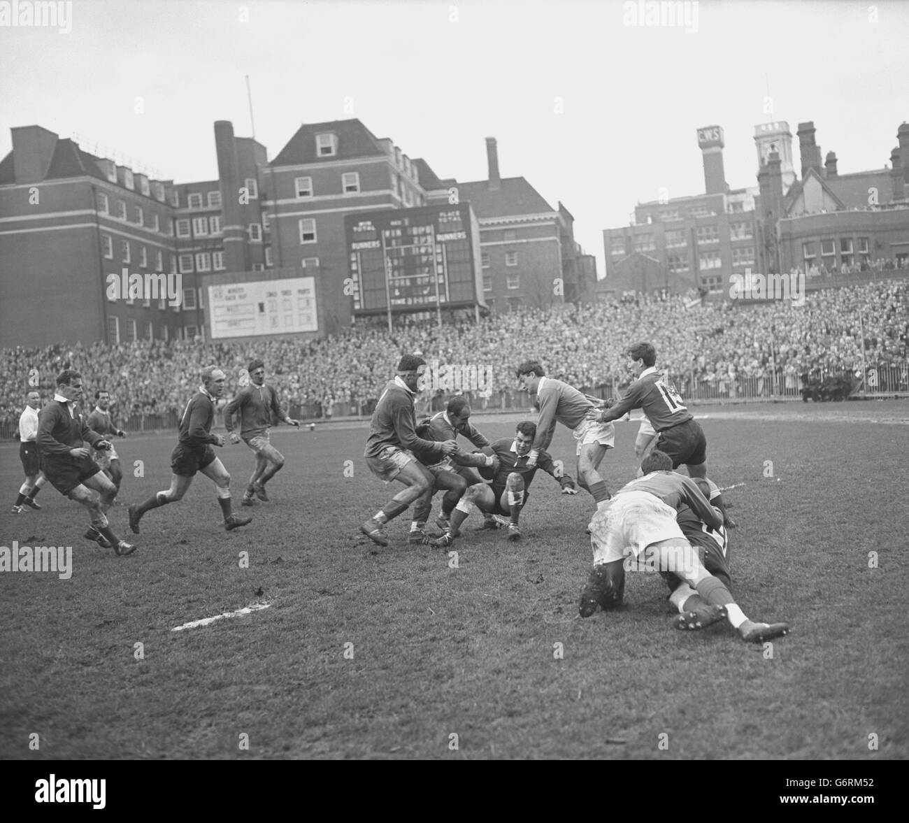 Keith Bradshaw, Wales, is tackled by a group of Frenchmen Stock Photo ...