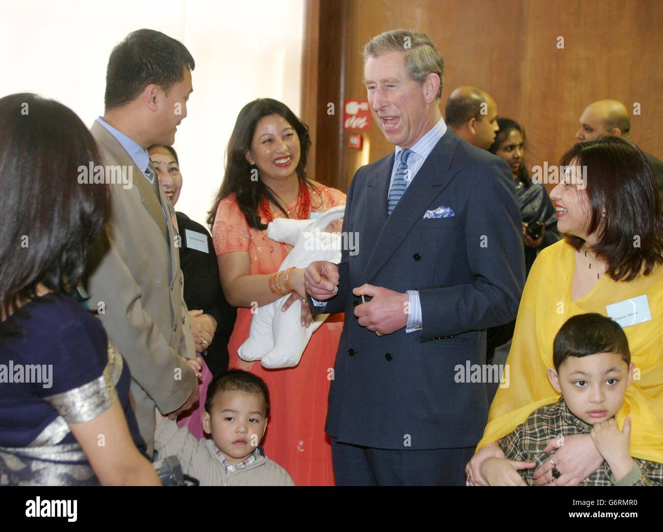 The Prince of Wales chats with immigrants who became the first to take ...