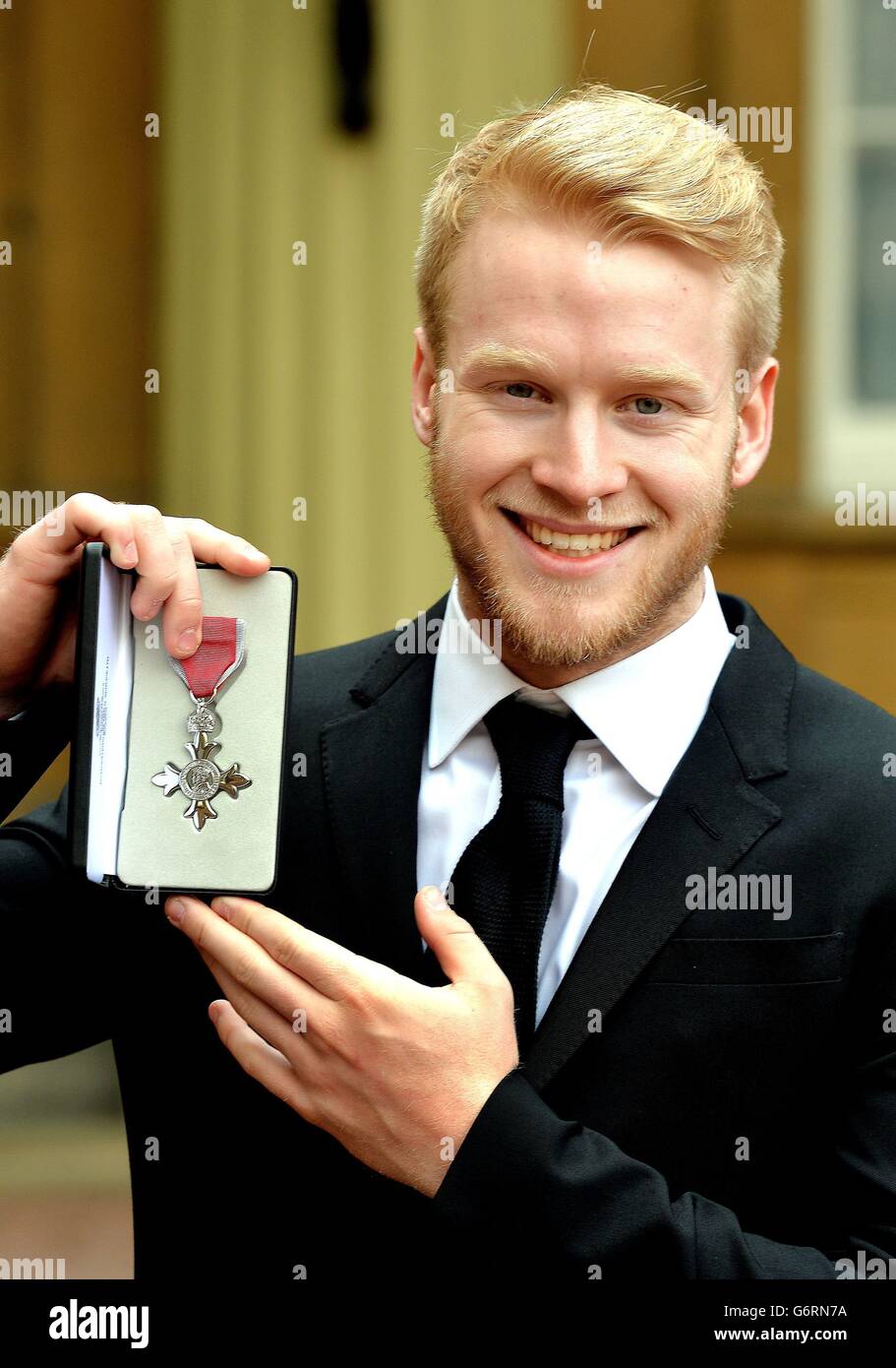 Paralympic sprinter Jonathan Peacock holds his MBE (Member of the ...