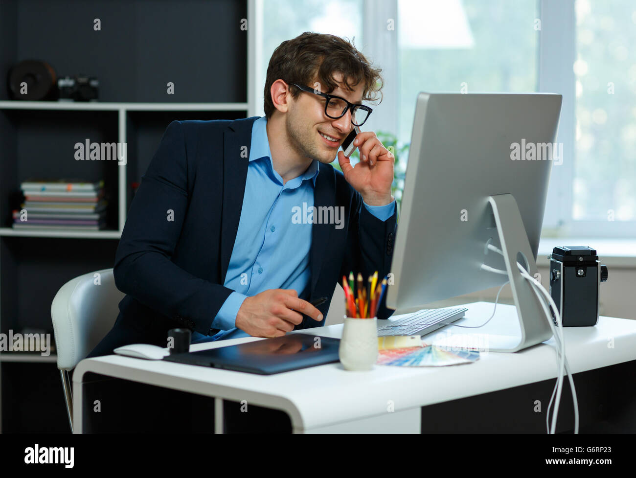 Handsome young man working from home office - modern business concept ...