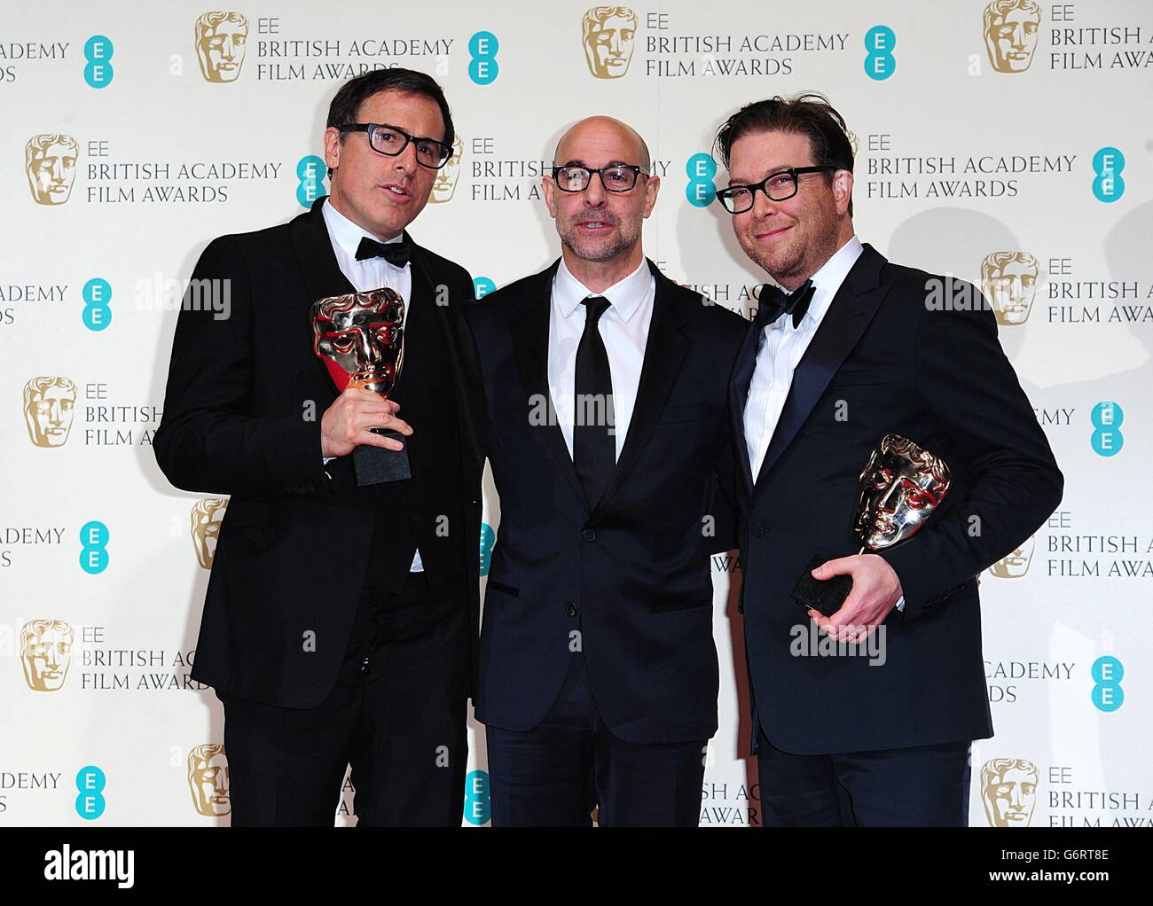 David O. Russell (left) and Eric Warren Singer (right) with the award ...