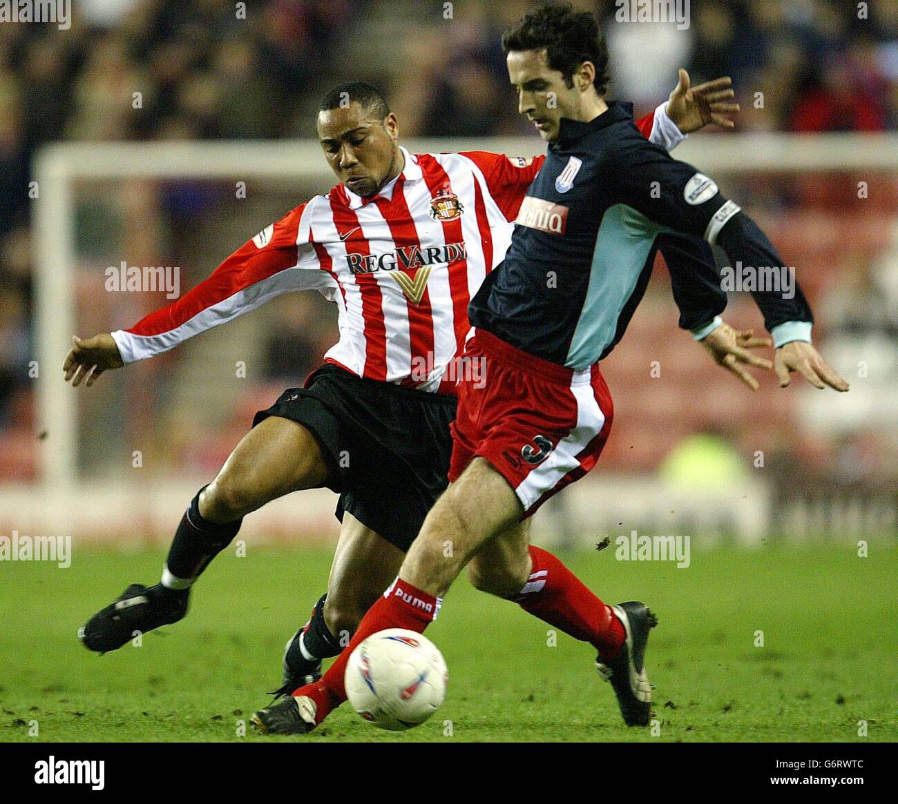 Sunderlands Jeff Whitley battles with Stoke city's Clive Clarke during ...