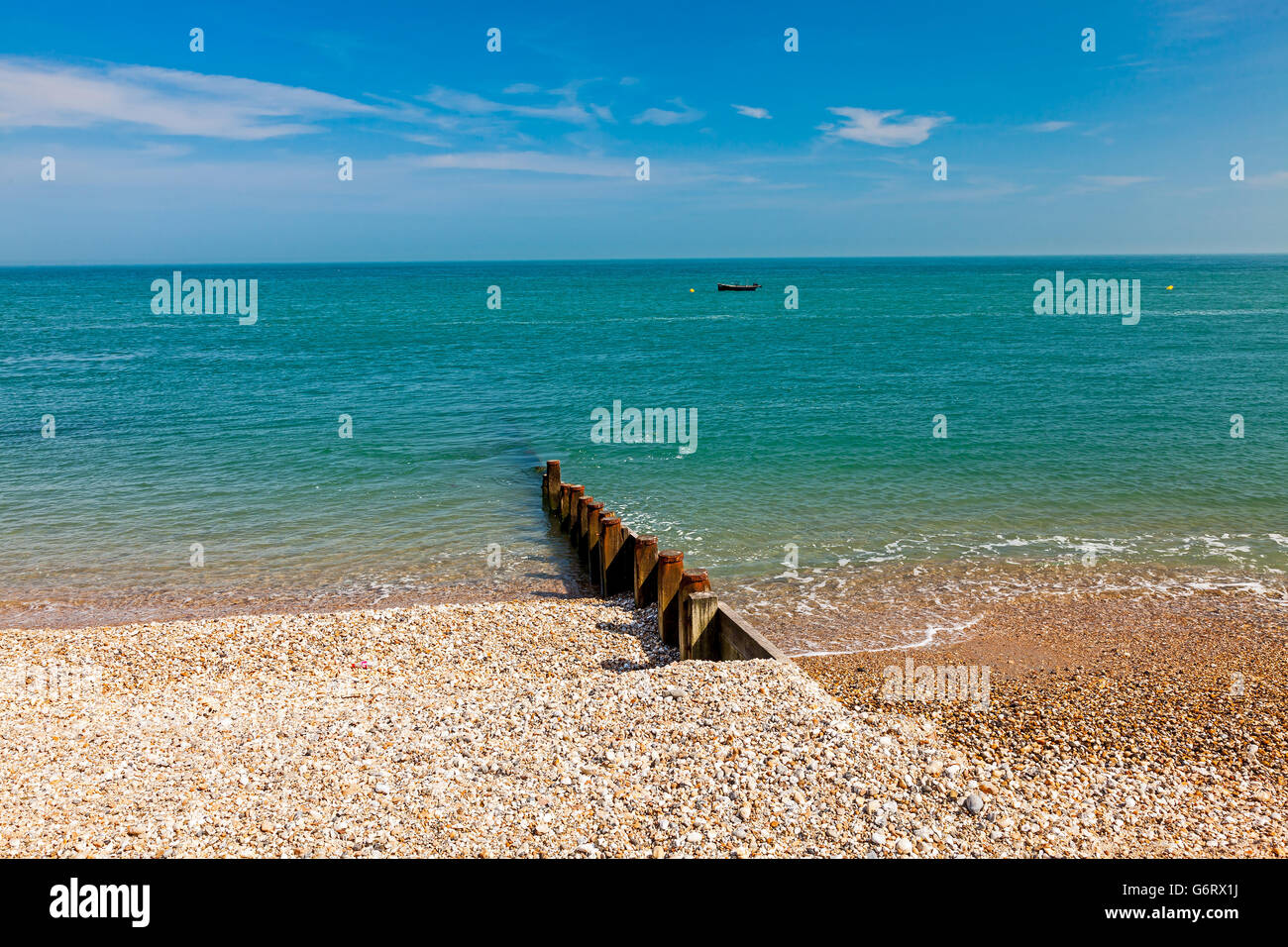 Timber groyne on the shingle beach at Selsey Bill West Sussex England ...