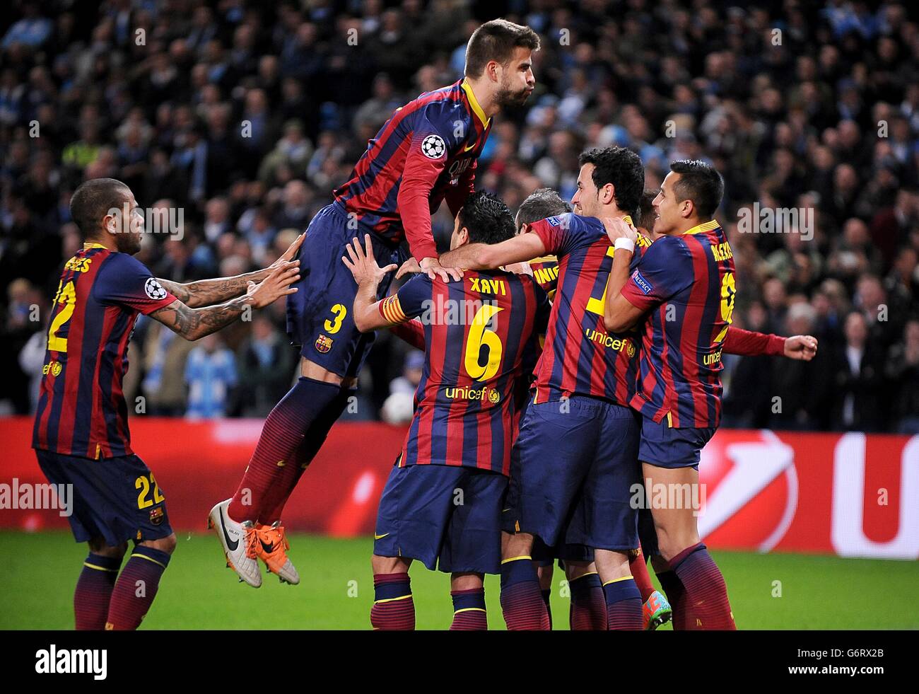 Barcelona's Lionel Messi is mobbed by his team-mates after scoring his ...