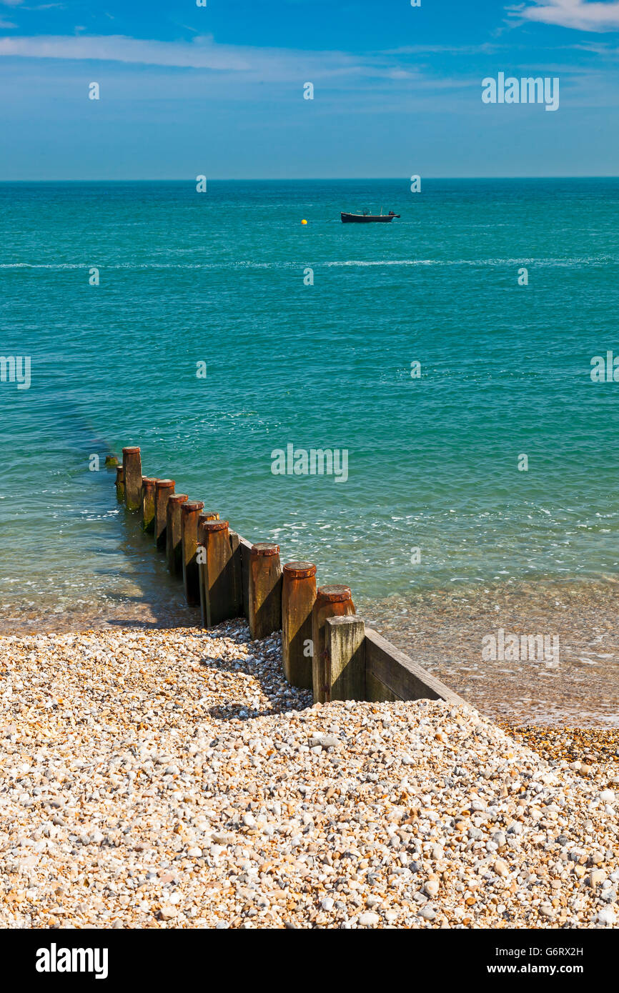 Timber groyne on the shingle beach at Selsey Bill West Sussex England ...
