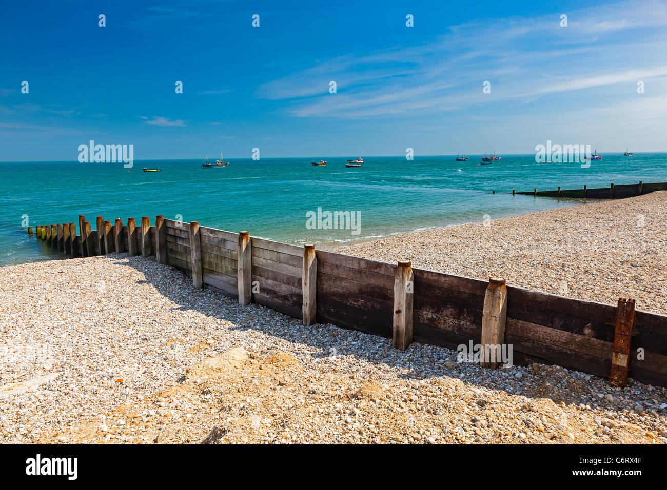 Timber groyne on the shingle beach at Selsey Bill West Sussex England ...
