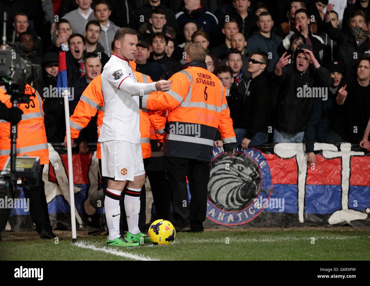 Manchester United's Wayne Rooney reacts after an object was thrown from ...