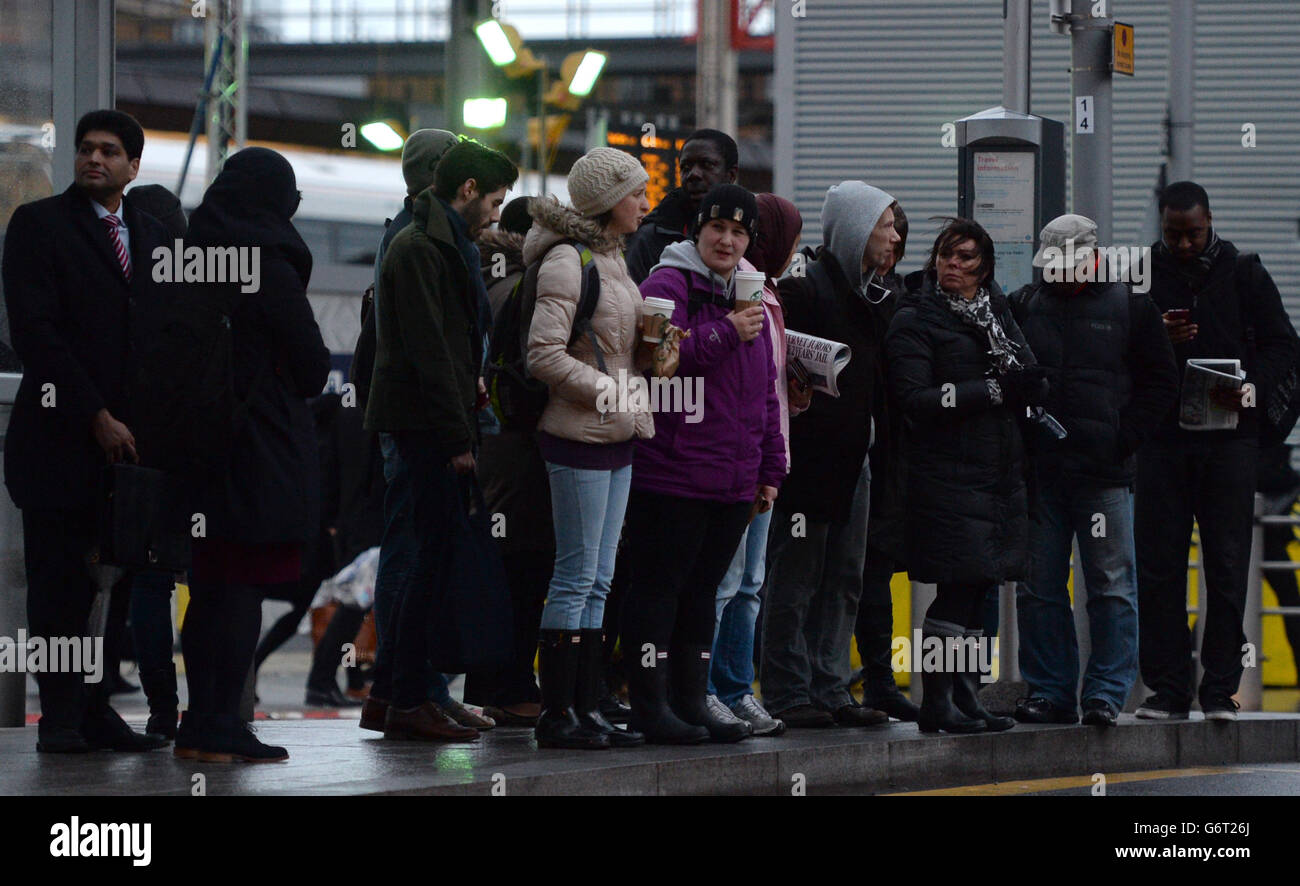 Commuters wait for a replacement bus service at London Bridge, London ...