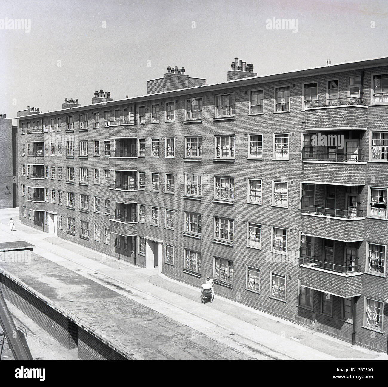 1950s, historical picture showing a newly brick built five story block ...