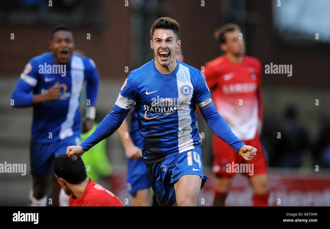 Peterborough United's Tommy Rowe (centre) celebrates scoring the ...