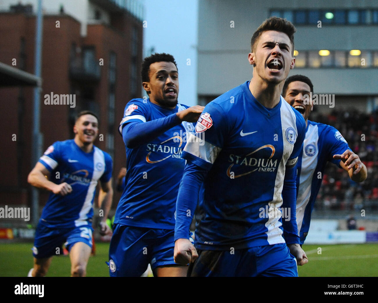 Peterborough United's Tommy Rowe (second right) celebrates scoring the ...