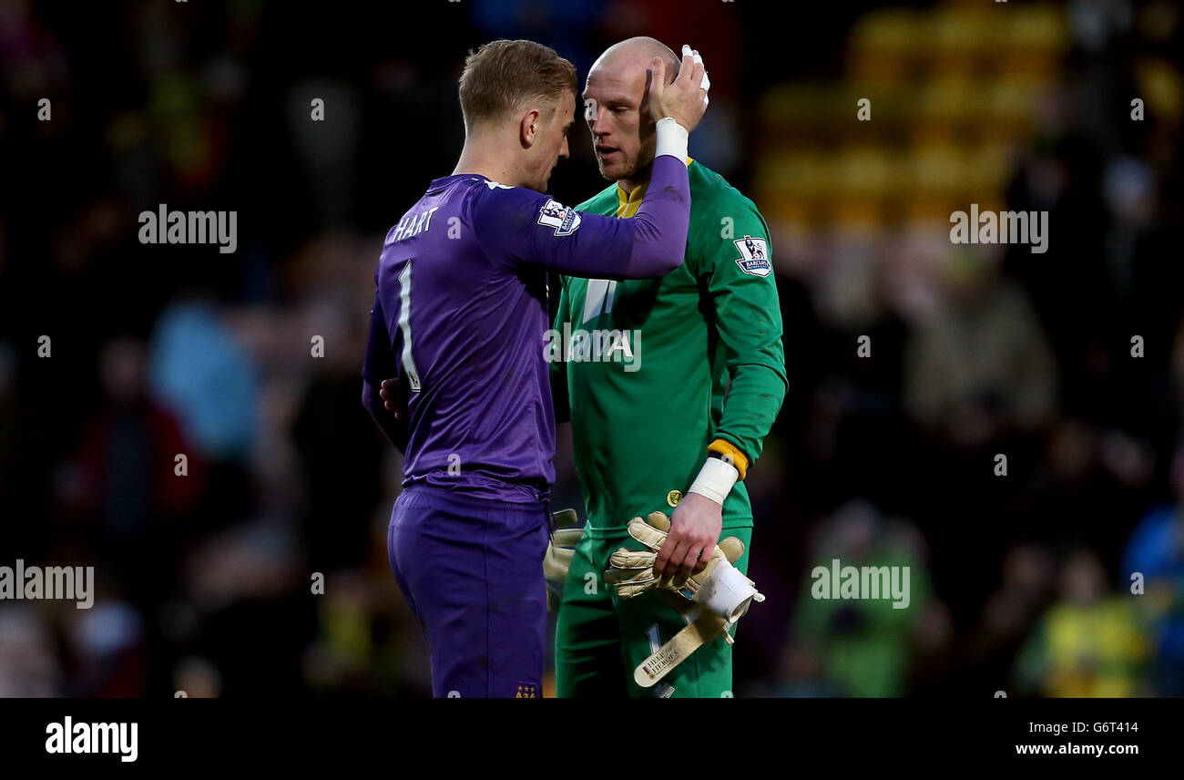 Norwich City's goalkeeper John Ruddy (right) and Manchester City's ...