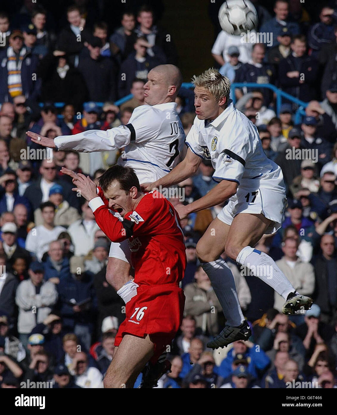 Leeds' Alan Smith (right) and Seth Johnson jump for the ball with ...