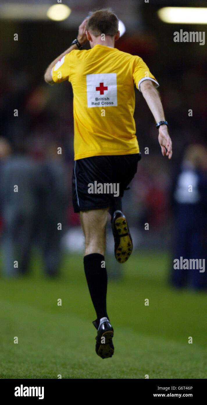 Referee wearing red shirt hi-res stock photography and images - Alamy