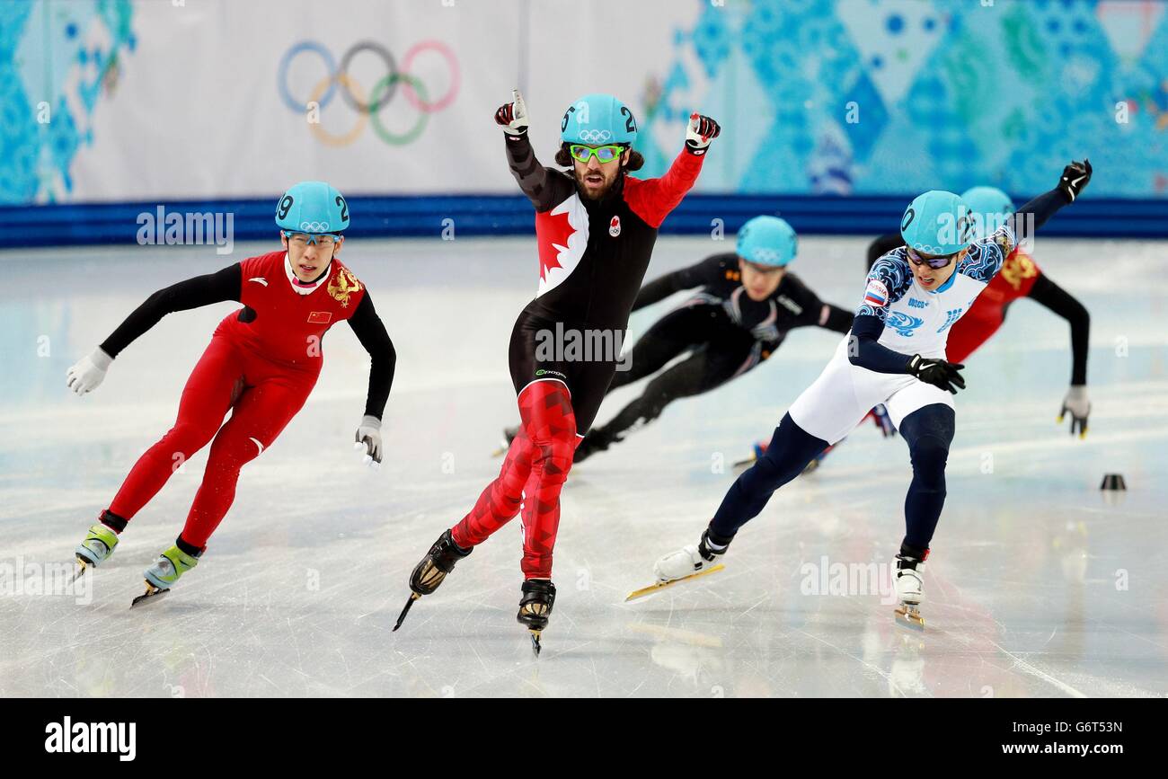 Canada's Charles Hamelin celebrates as he crosses the line to win gold ...
