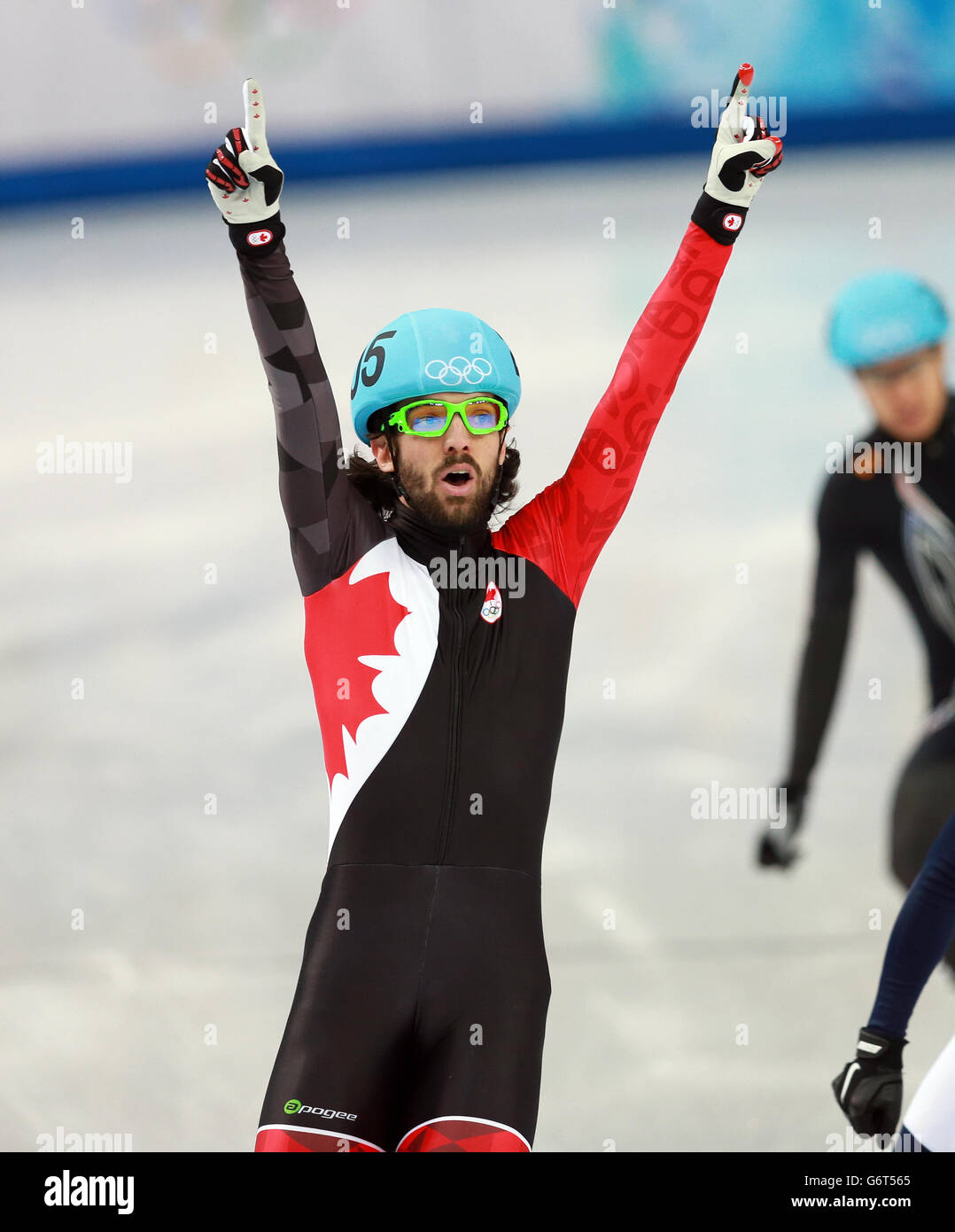Canada's Charles Hamelin celebrates as he crosses the line to win gold ...