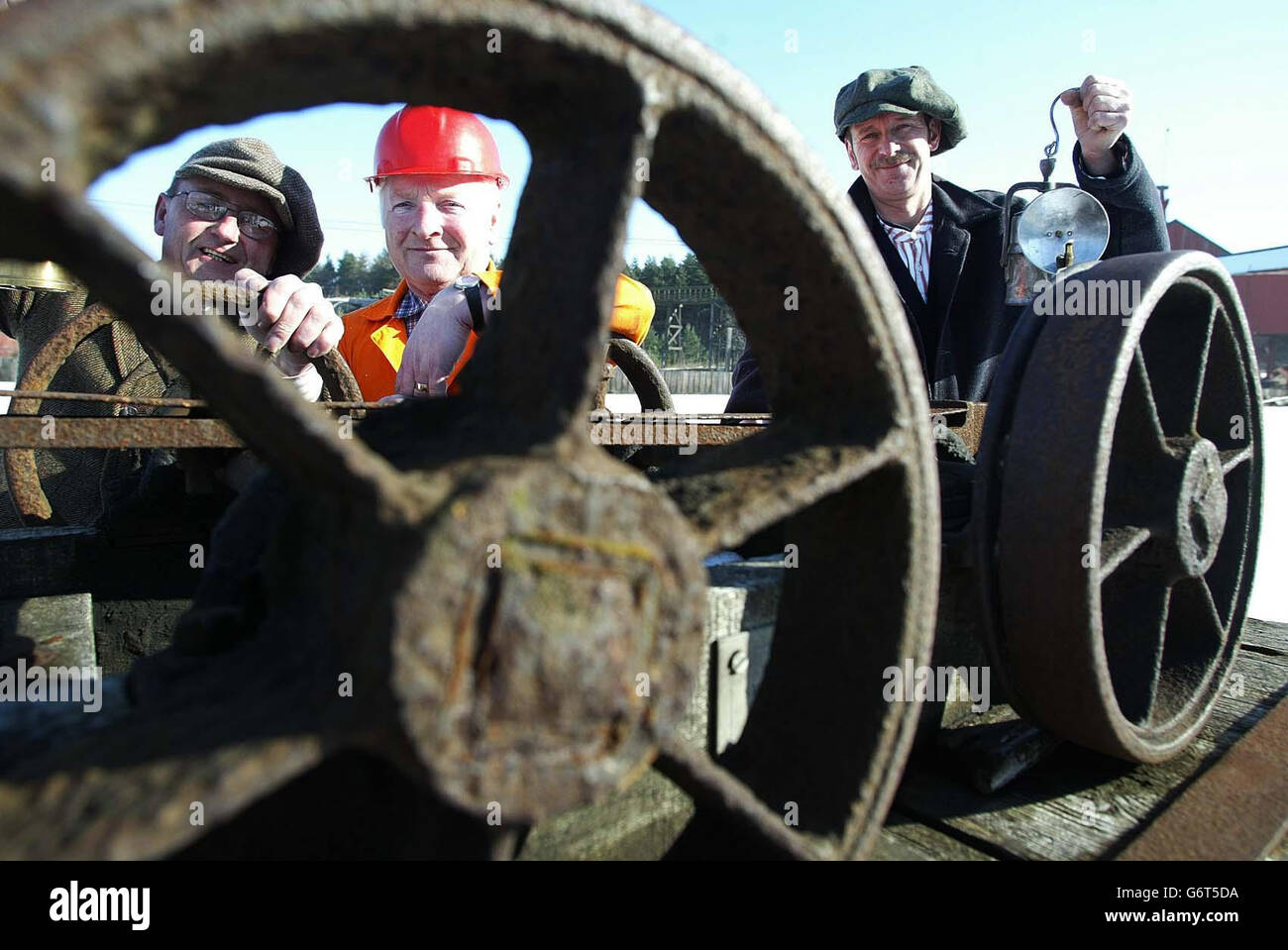 Retiring miner Martin Gallagher (centre) with ex-pitmen Stuart Davison ...