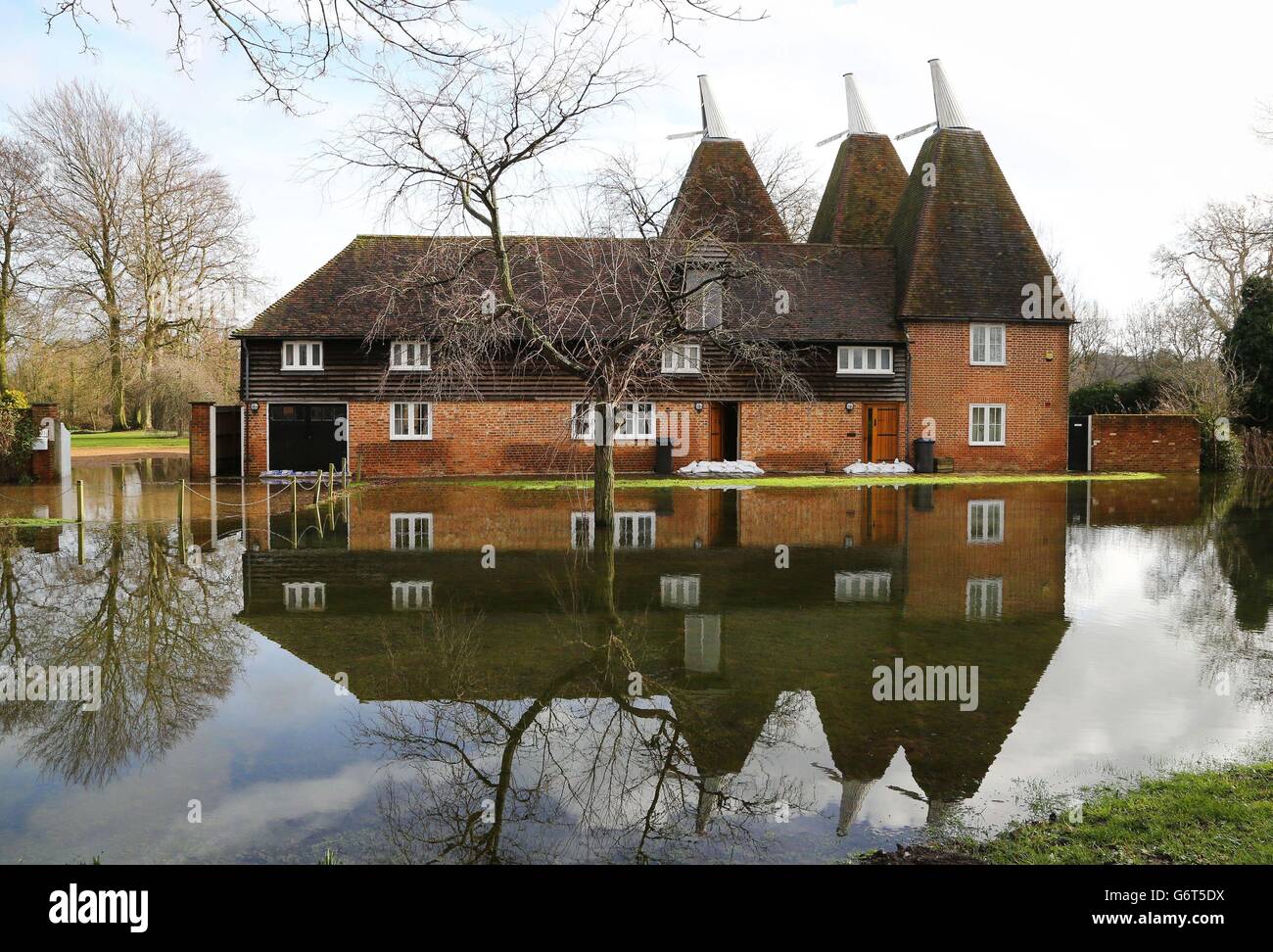 Floodwater surrounds an oast house in Littlebourne, Kent, as river ...