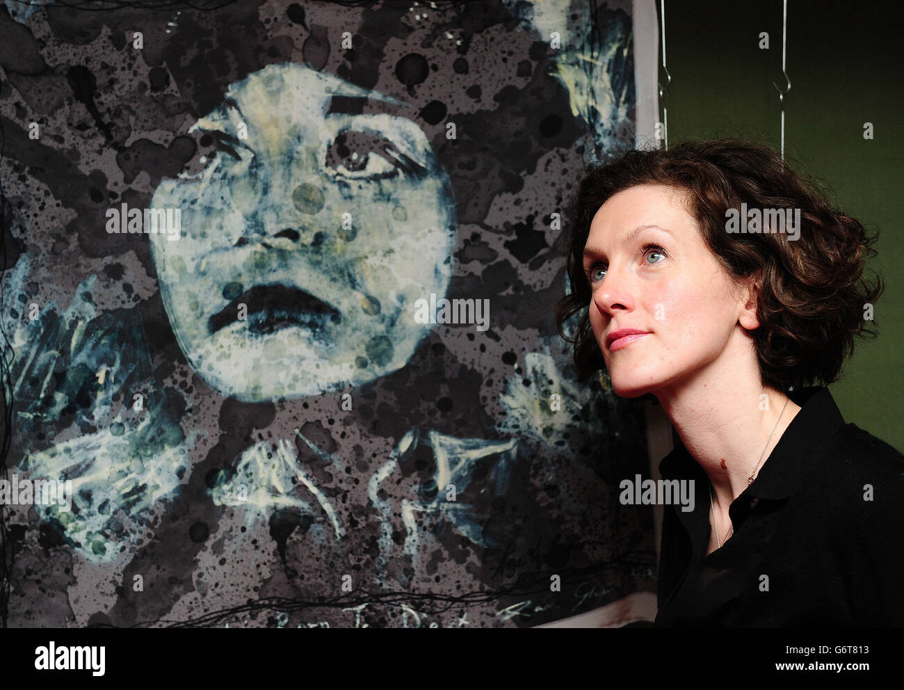 Pam Glew, with the scarf she designed, attending a drinks reception to ...