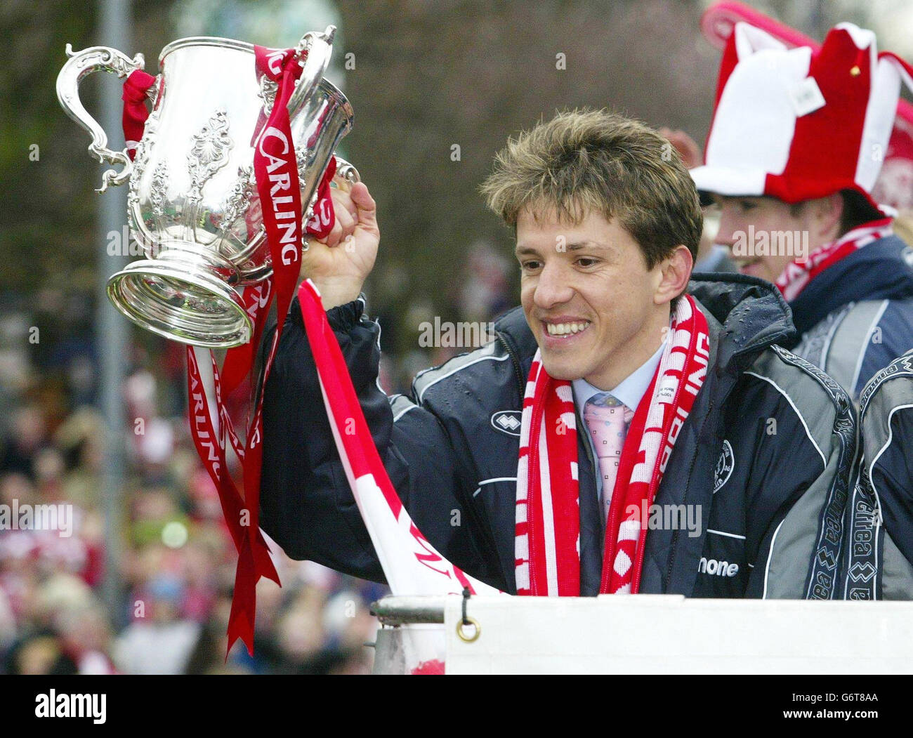 Middlesbrough's Juninho holds up the Carling Cup in the open top bus ...