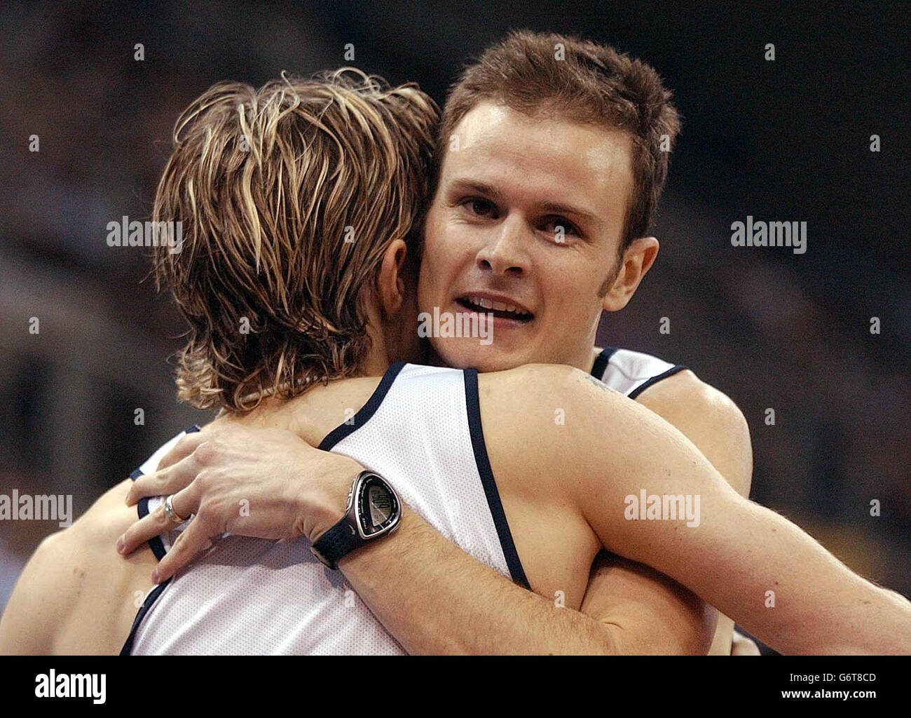 Michael East (facing) of Great Britain is congratulated by James Thie ...