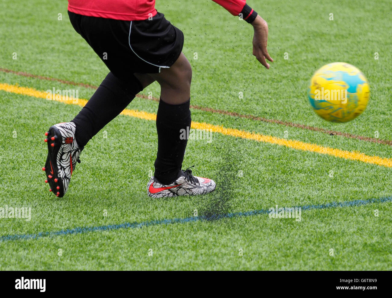 Close up of a young person playing football Stock Photo - Alamy