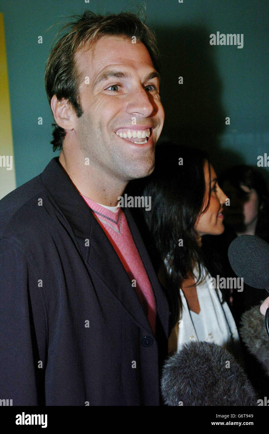 British tennis star Greg Rusedski walks with his wife, Lucy, after ...