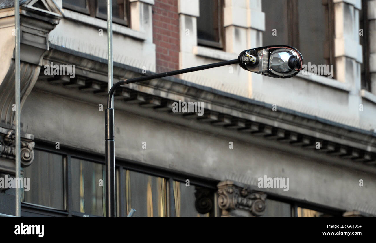A damaged lamp post above the scene in Kingsway, opposite Holborn Tube ...
