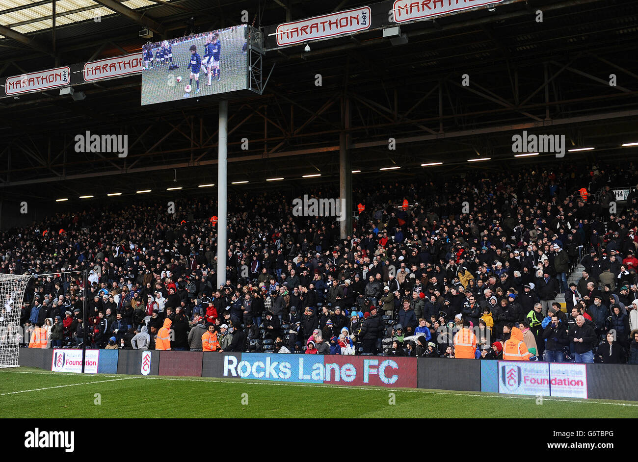 Fans watch as young players from Rocks Lane Football Club take part in ...