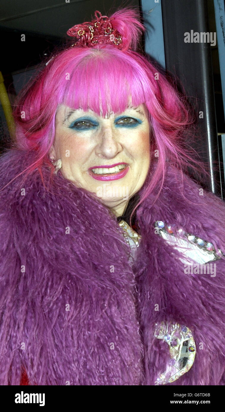Fashion designer Zandra poses for photographers in a London bus ...