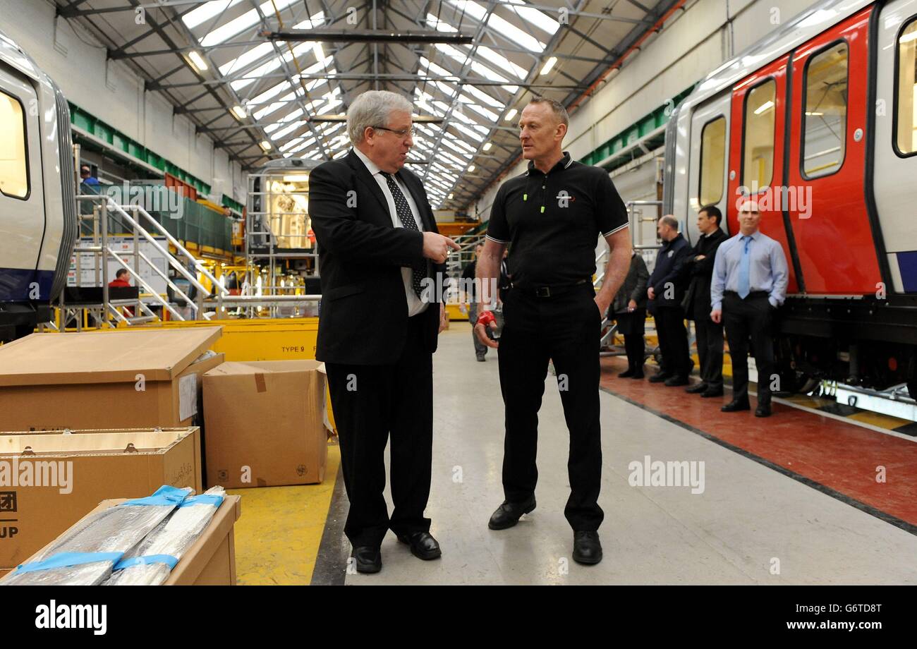 Transport Secretary Patrick McLoughlin (left) is given a tour of the ...