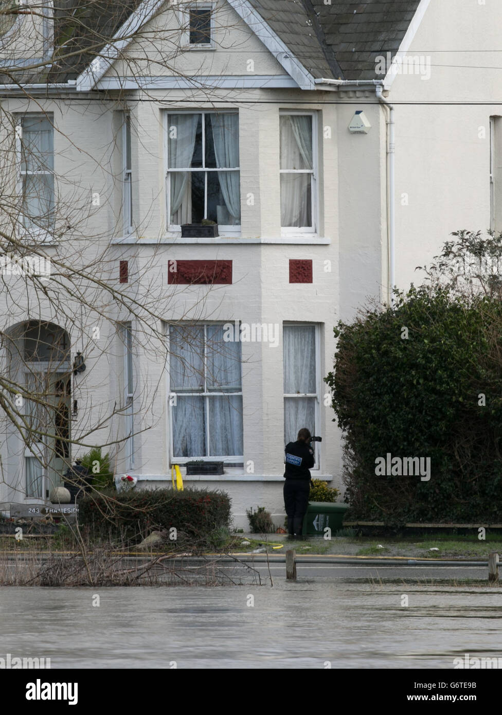 Scene of crime officers at a house in Thameside in Chertsey, Surrey ...