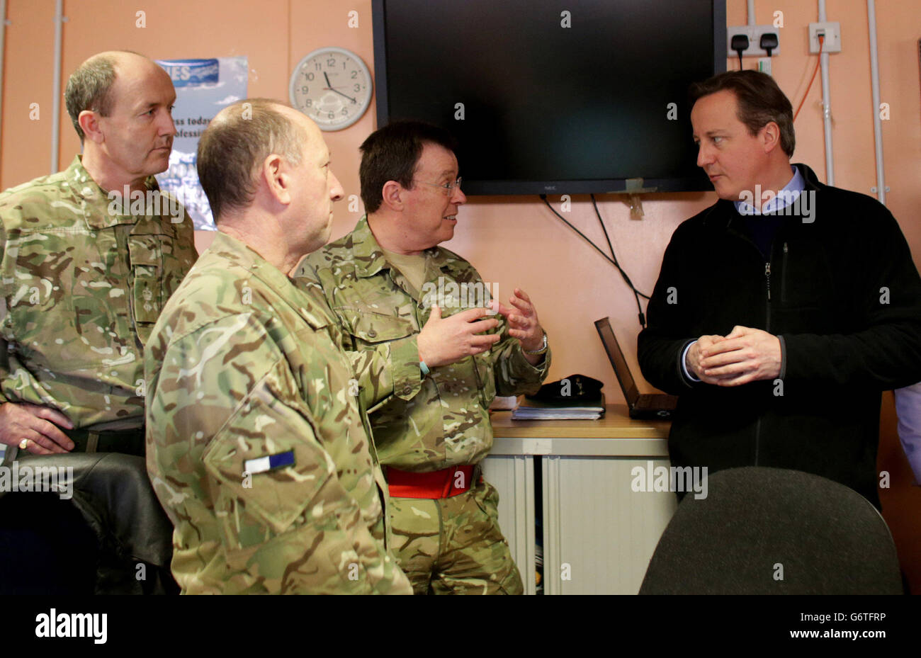 Prime Minister David Cameron talks to Army reservists as he is shown ...