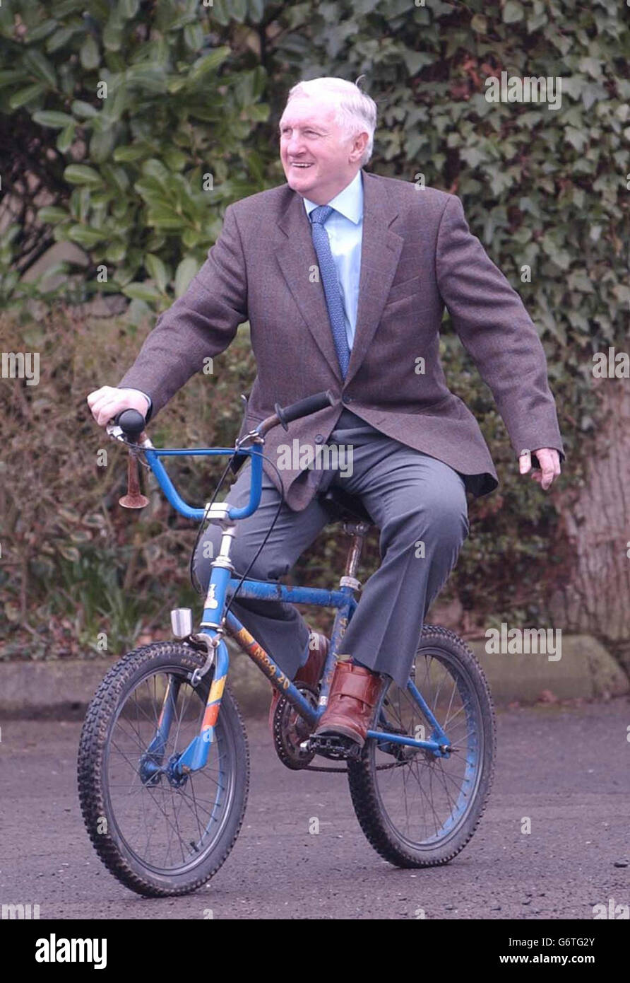 Martin Pipe rides his bike around the yard. Cheltenham trainer Martin ...