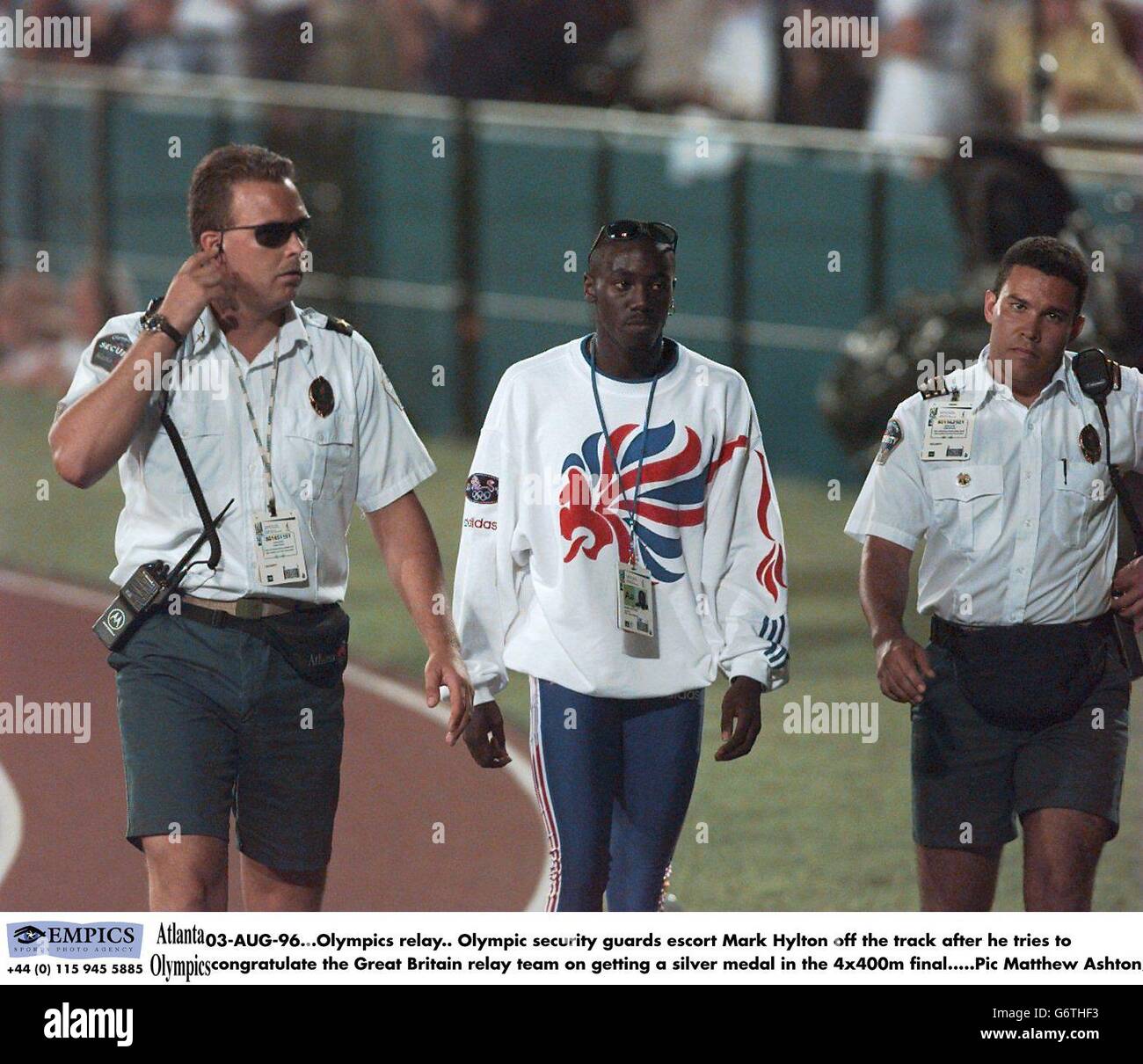 03-AUG-96. Olympics relay. Olympic security guards escort Mark Hylton ...