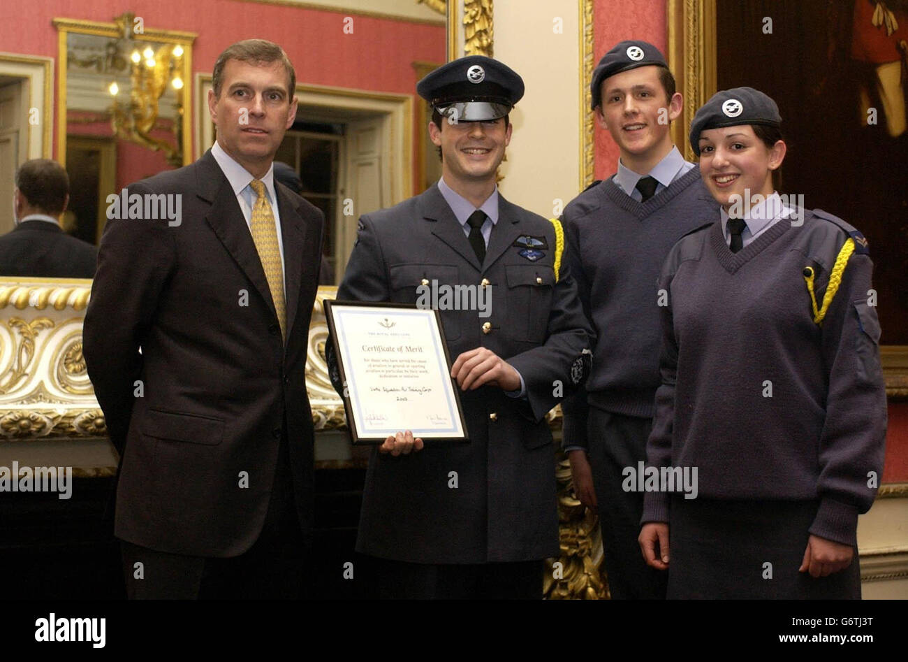 Prince Andrew stands with (L to R) Cadet Warrent Officer Patrick Smith ...